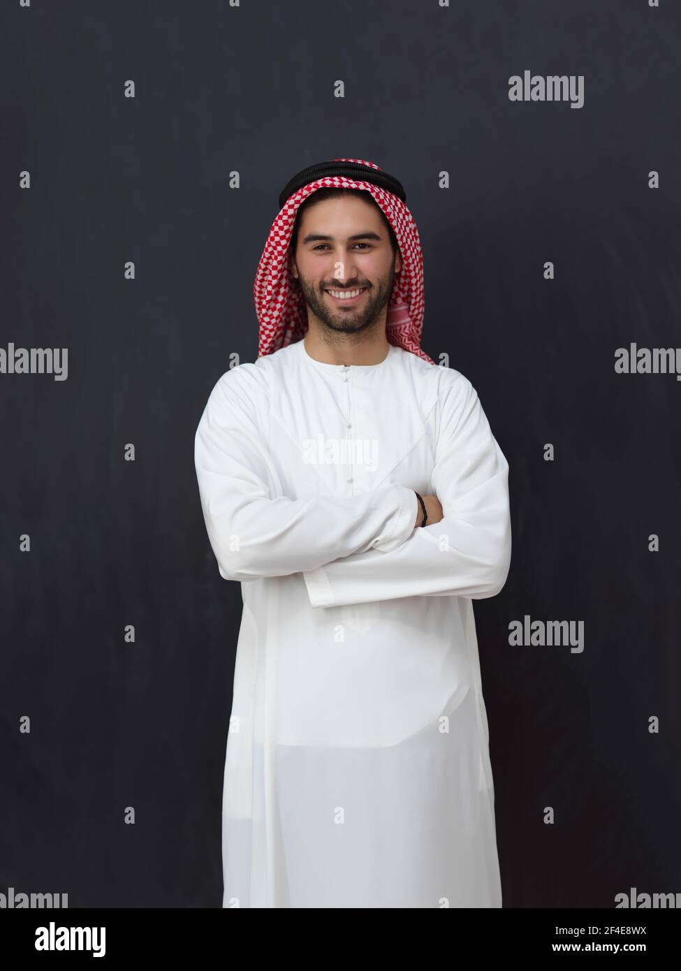 Portrait of young muslim man wearing traditional clothes Stock Photo ...