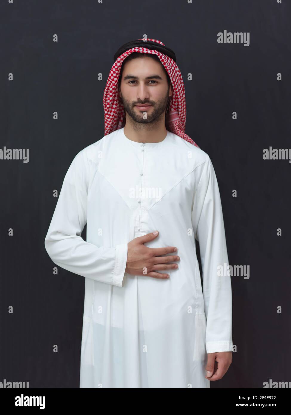 Portrait of young muslim man wearing traditional clothes Stock Photo ...