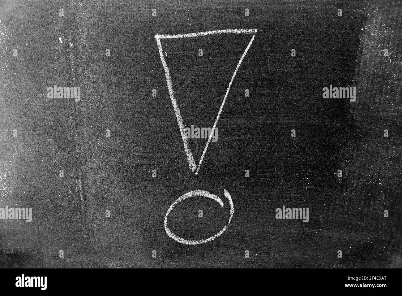 White color chalk hand drawing in exclamation mark with blank space ...