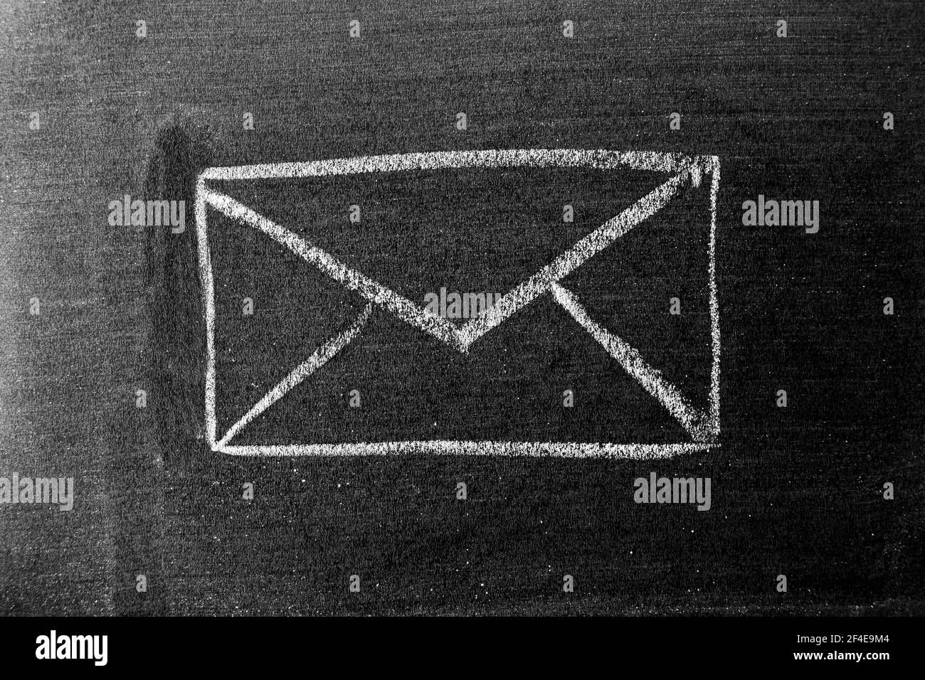 White color chalk drawing in mail envelope icon on blackboard or ...