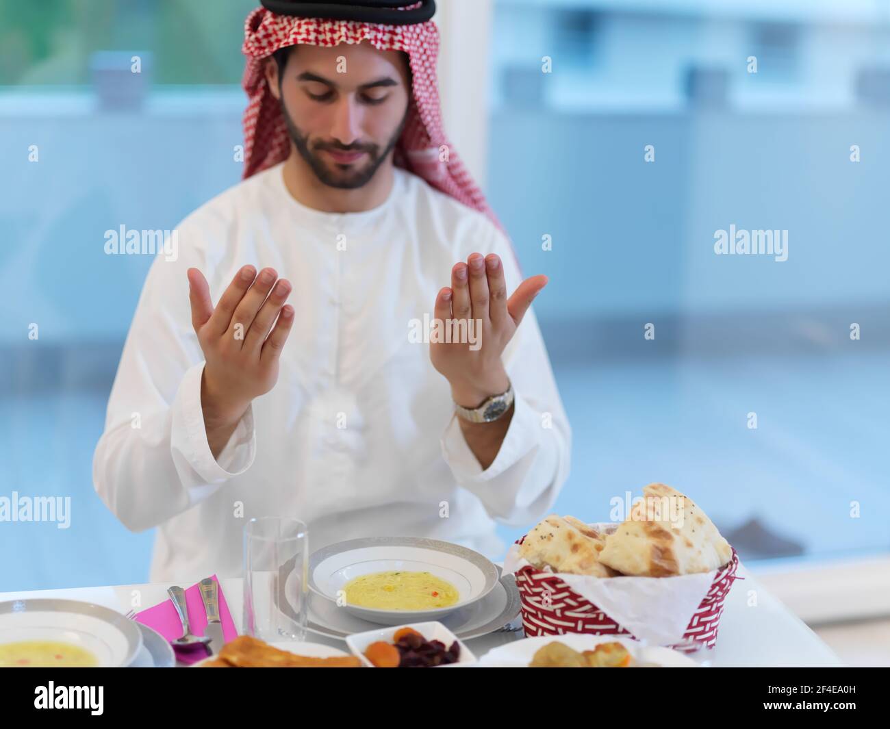 Muslim man making iftar dua to break fasting during Ramadan Stock Photo ...