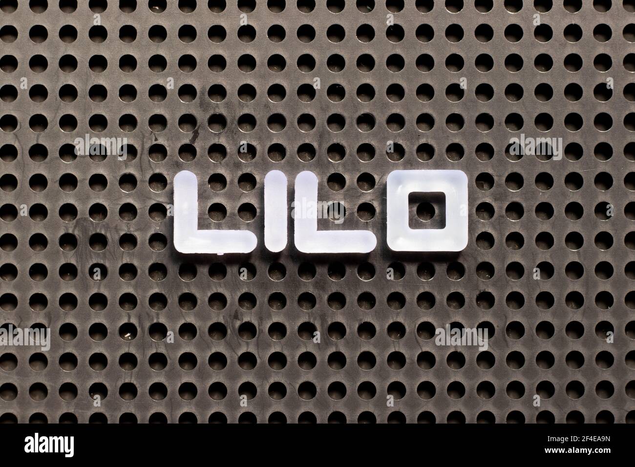 White color letter in word LILO (abbreviation of last in last out) on ...