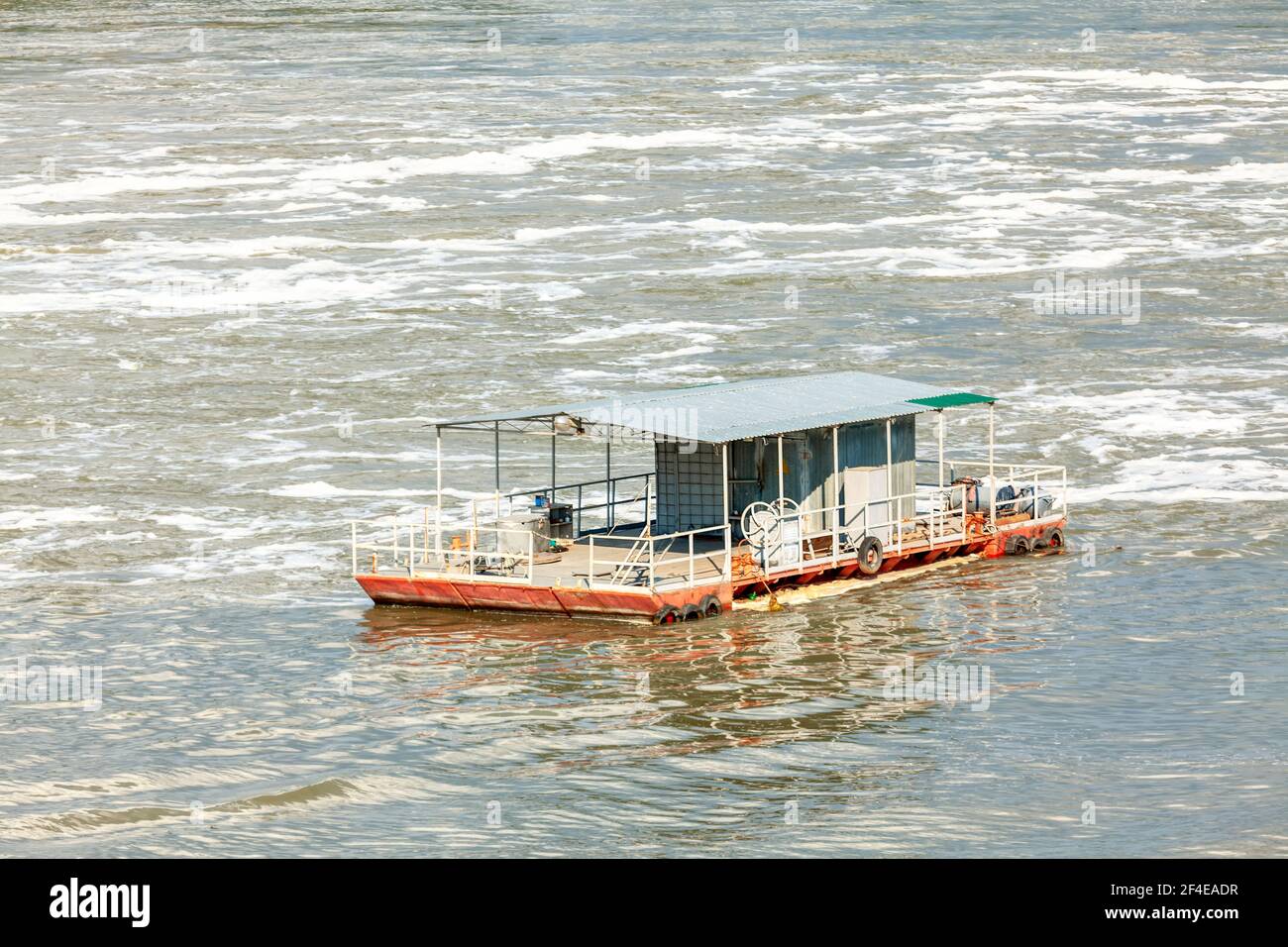 Floating small ferry for transportation people across the river Stock ...