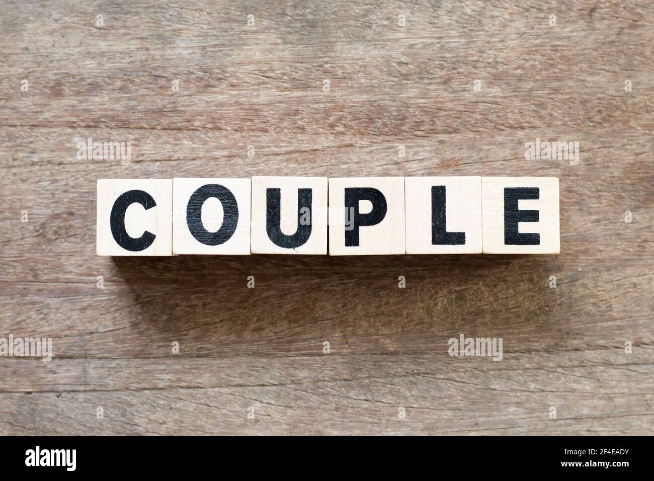 Alphabet letter block in word couple on wood background Stock Photo - Alamy