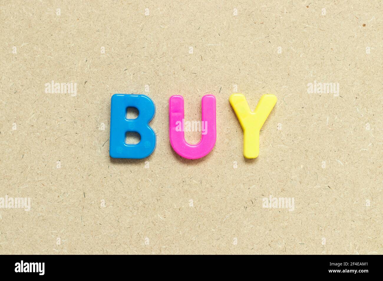 Color alphabet letter with word buy on wood background Stock Photo - Alamy
