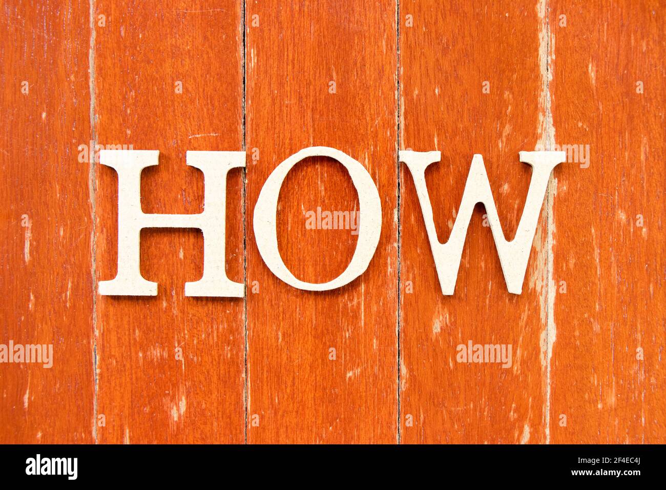 Alphabet letter in word how on old red color wood plate background ...