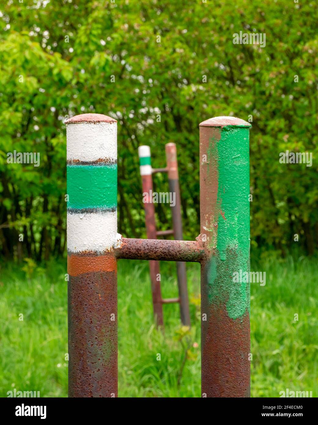 Rusty columns with tourist markings Stock Photo - Alamy