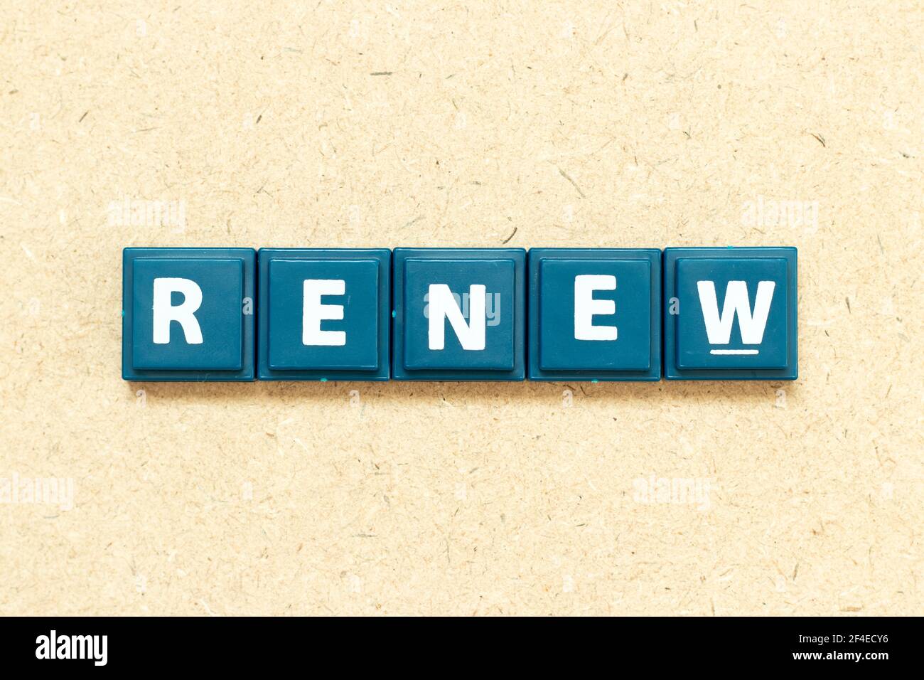 Tile alphabet letter in word renew on wood background Stock Photo - Alamy