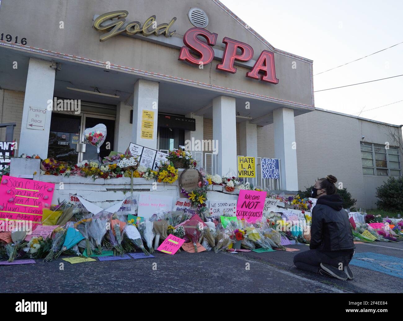 Atlanta, United States. 20th Mar, 2021. Rebekah Perry kneels at the ...