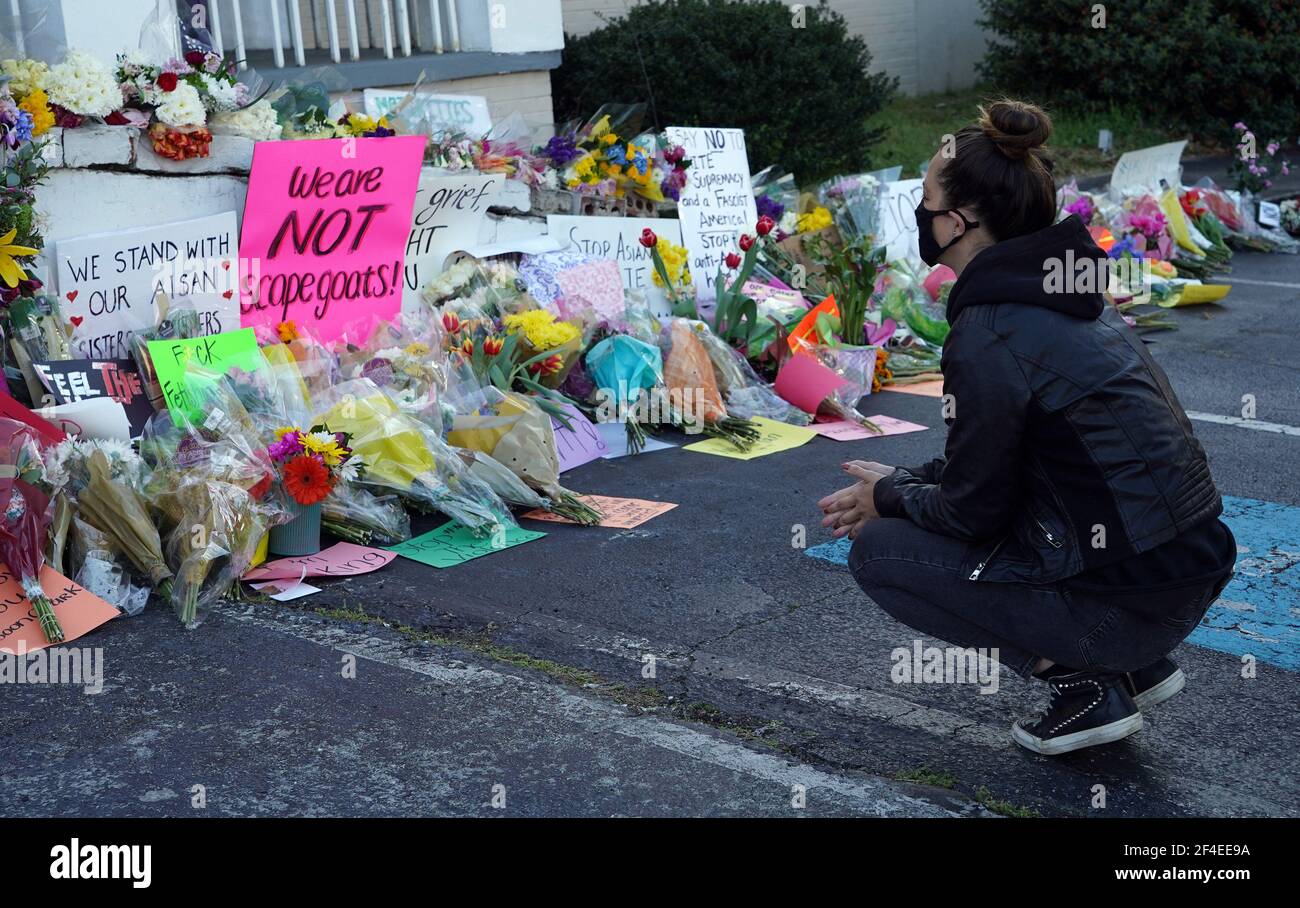 Atlanta, United States. 20th Mar, 2021. Rebekah Perry kneels at the ...
