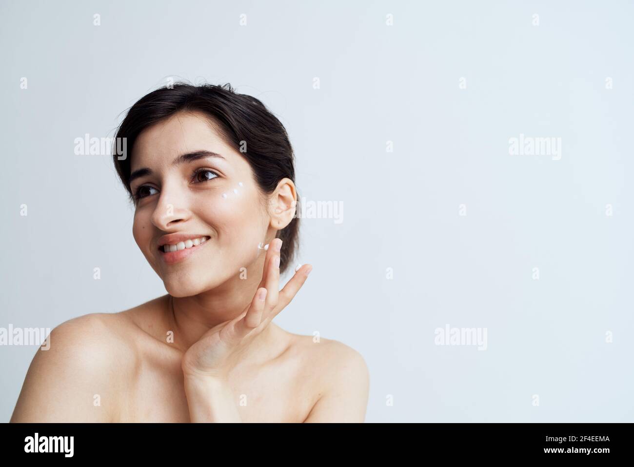 Beautiful brunette clean skin care face dermatology cream Stock Photo ...