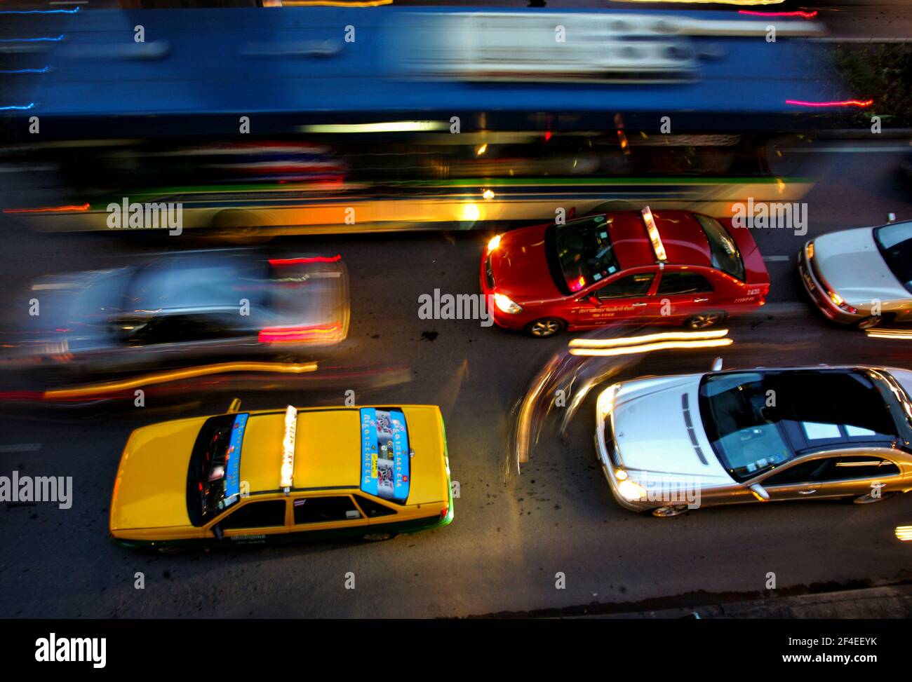 Cars and buses crowd the streets of Bangkok, Thailand contributing to ...