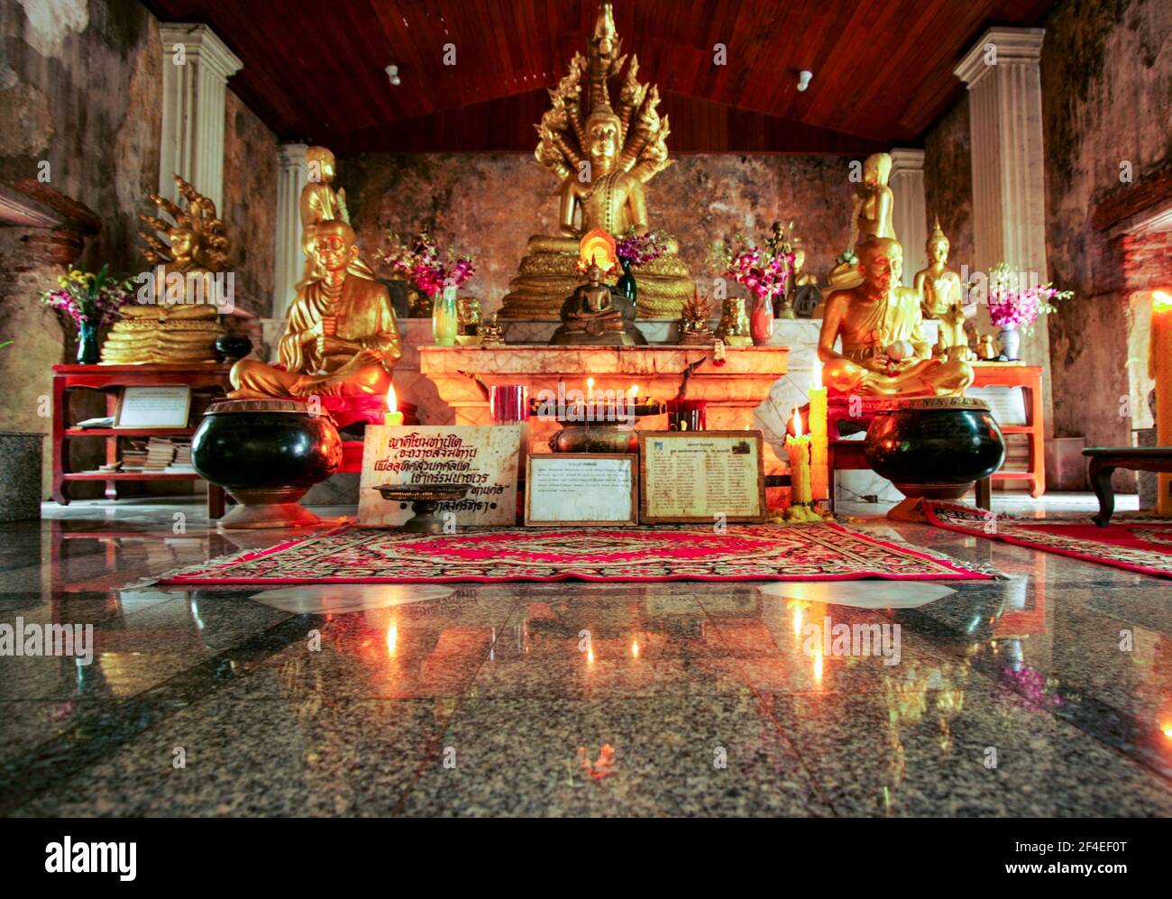 Inside a Buddhist temple that contains a "Calling the Earth to Witness ...