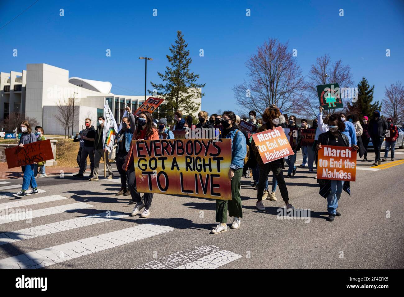 Protesters march in the middle of 17th Street on the way to Assembly ...