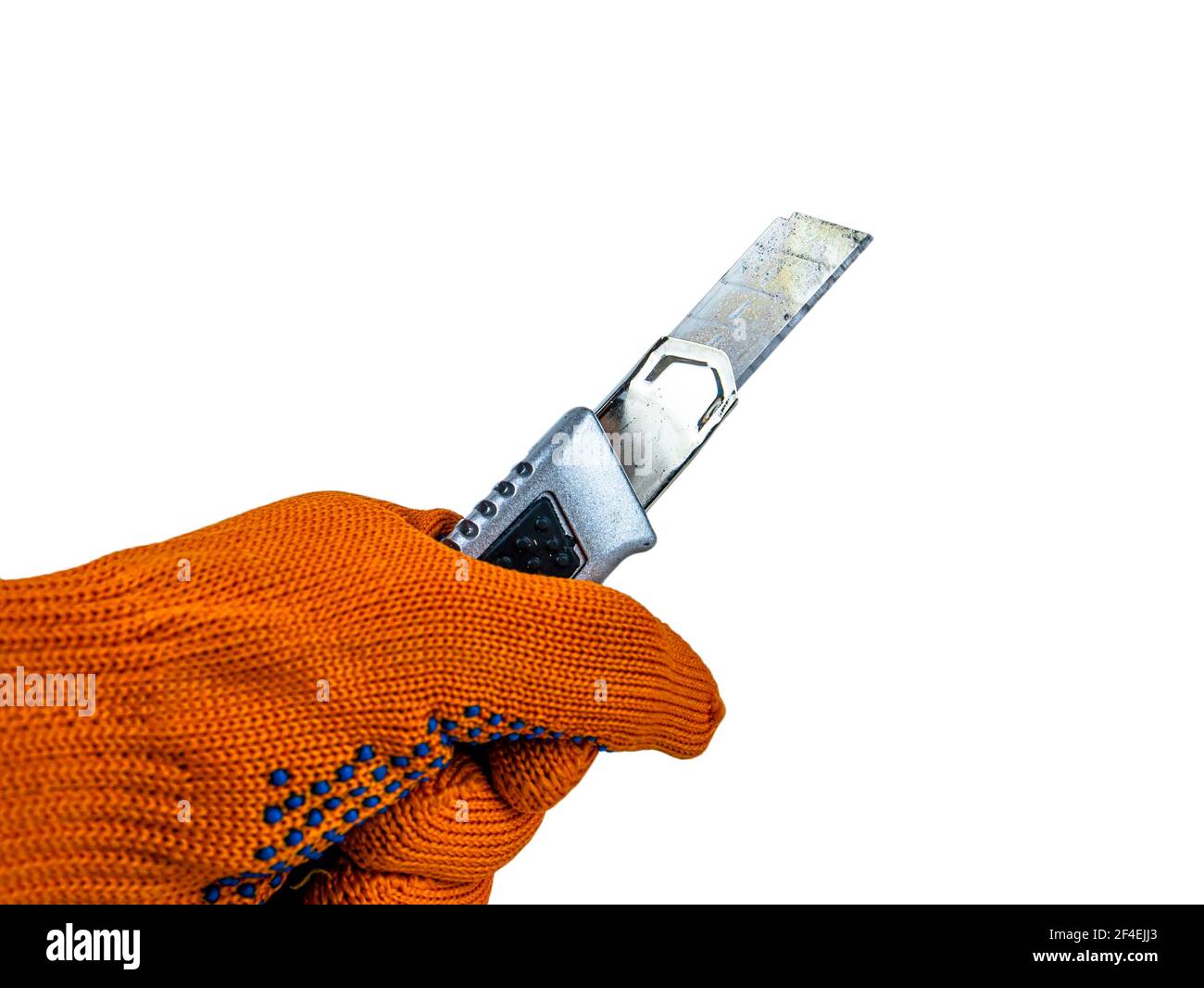 Construction knife in the hand of the builder Stock Photo - Alamy