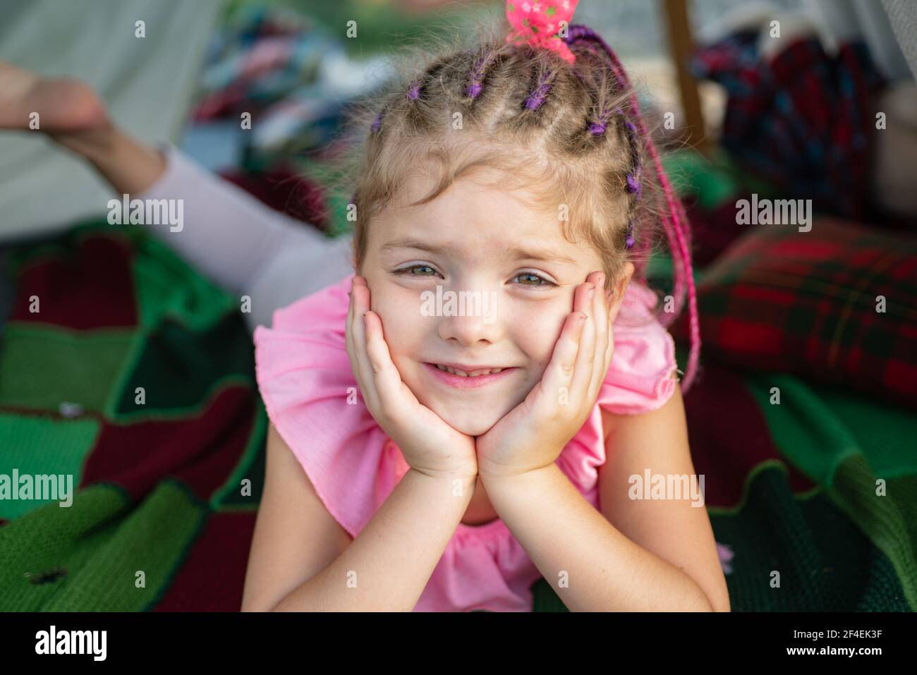 Smiling girl in tent. Kid playing in tent. Kids camping. Having fun ...