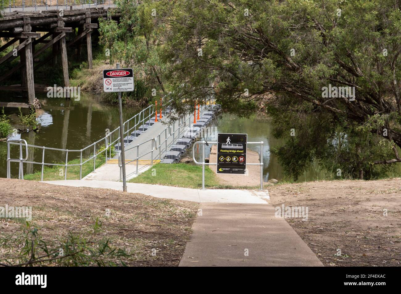 Signs at a temporary floating bridge over the Nagoya River In Emerald ...