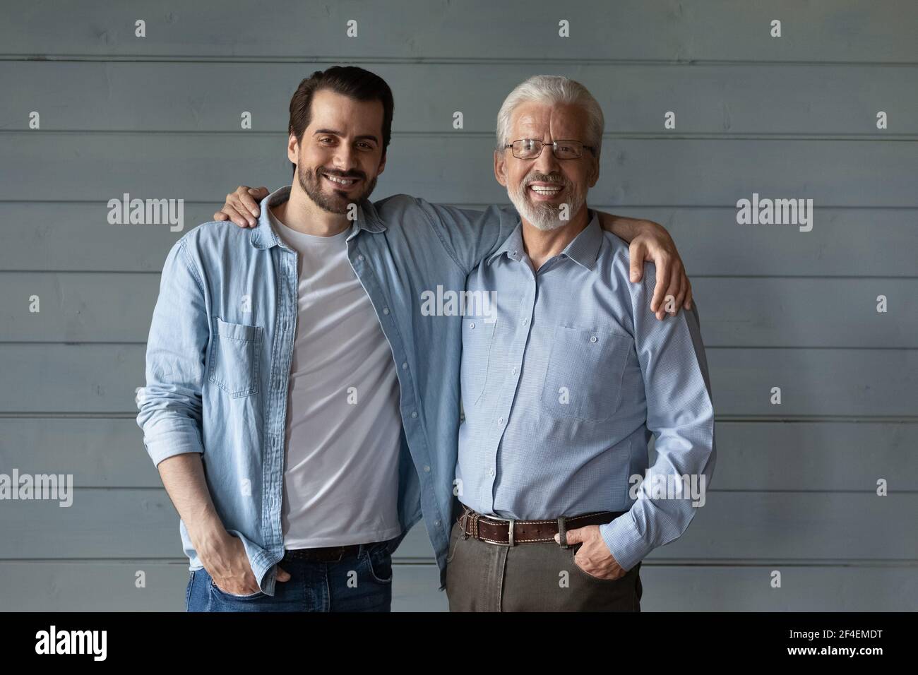 Portrait of happy old father and adult son hugging Stock Photo - Alamy