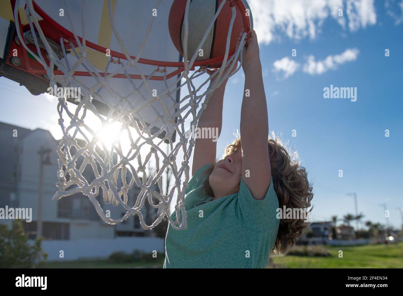 Basketball kids game. Cute little child boy holding a basket ball ...