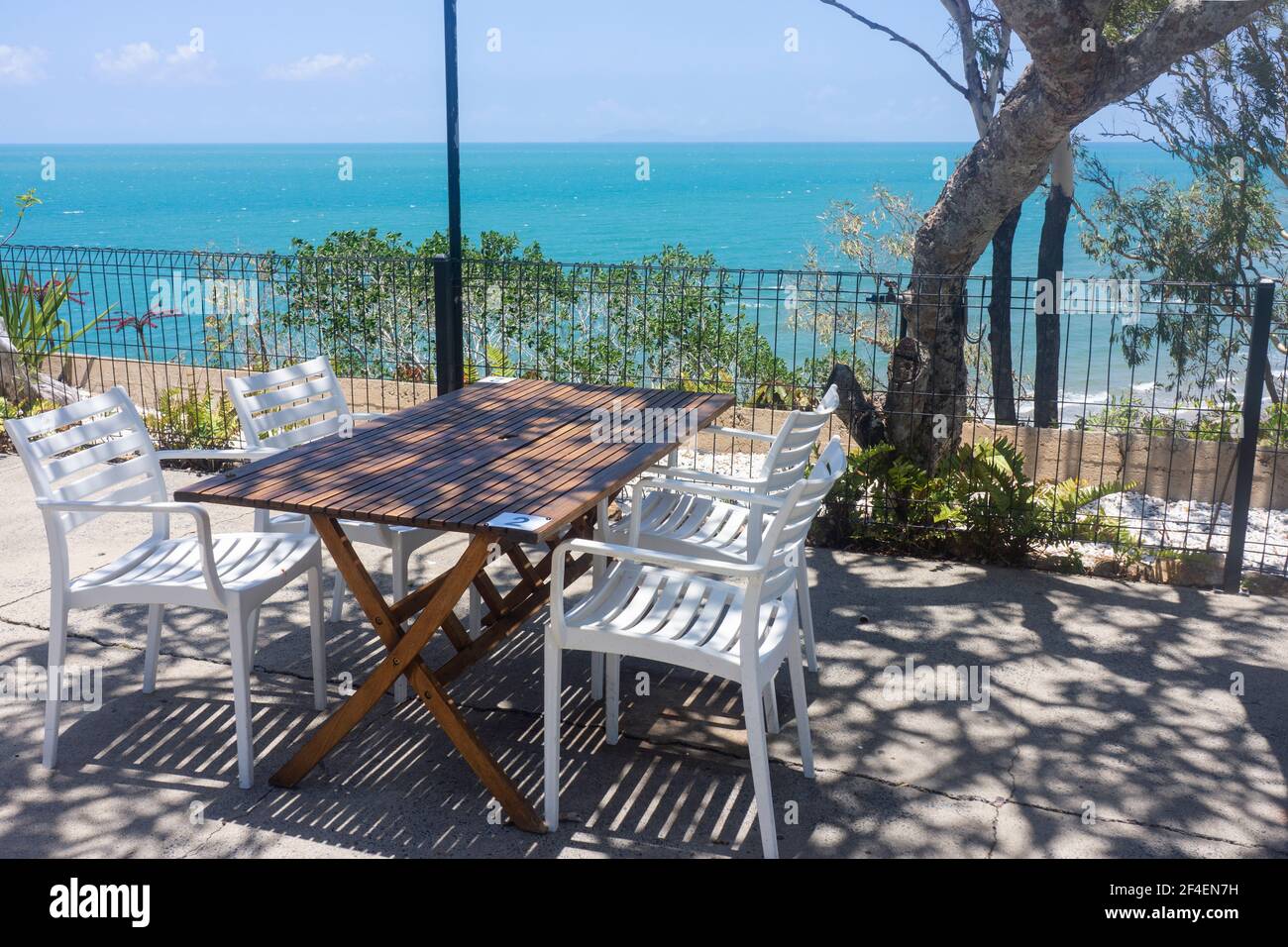 Cafe seating under gum trees with stunning ocean and sea views in ...