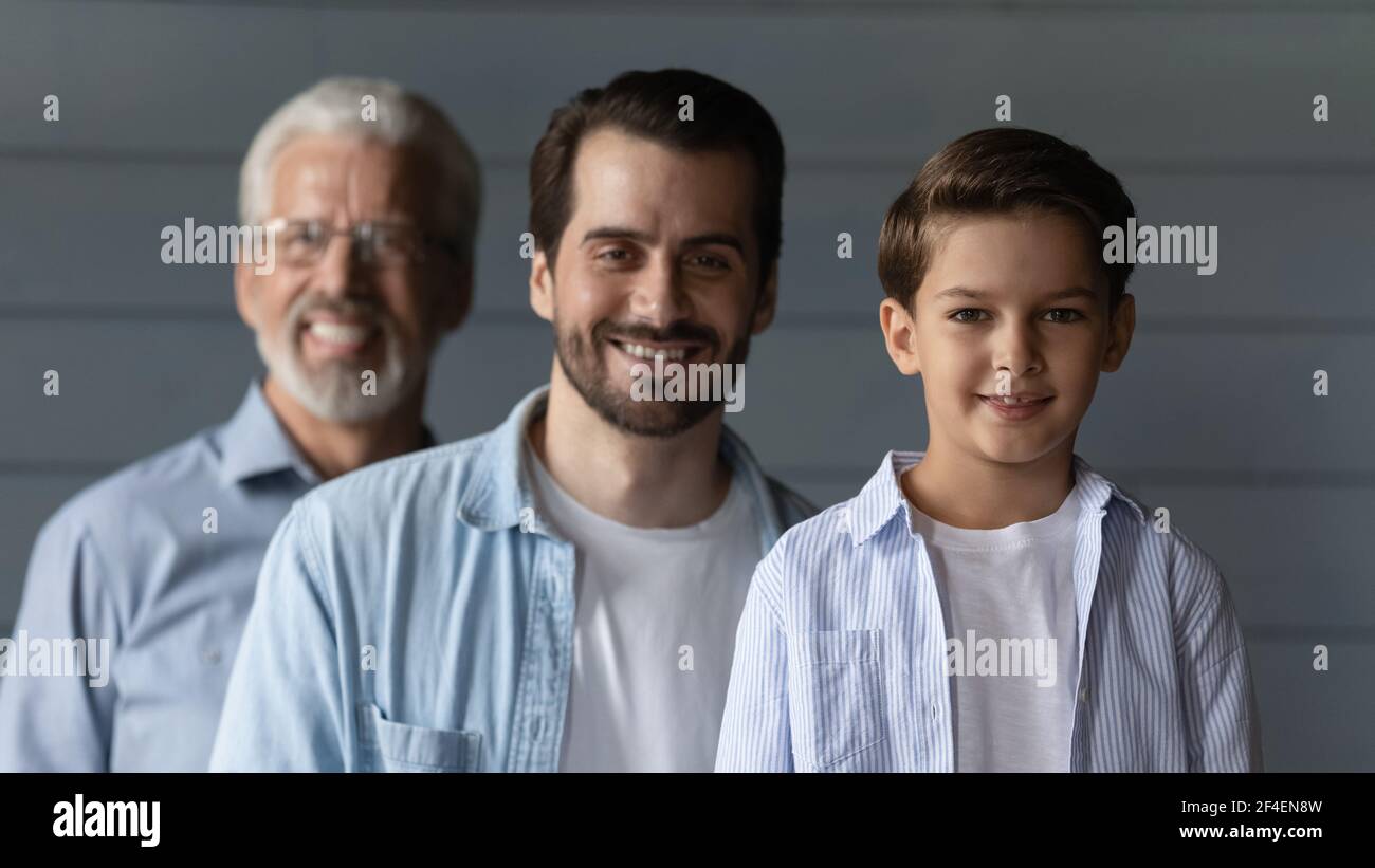 Portrait of happy three generations of men show unity Stock Photo - Alamy