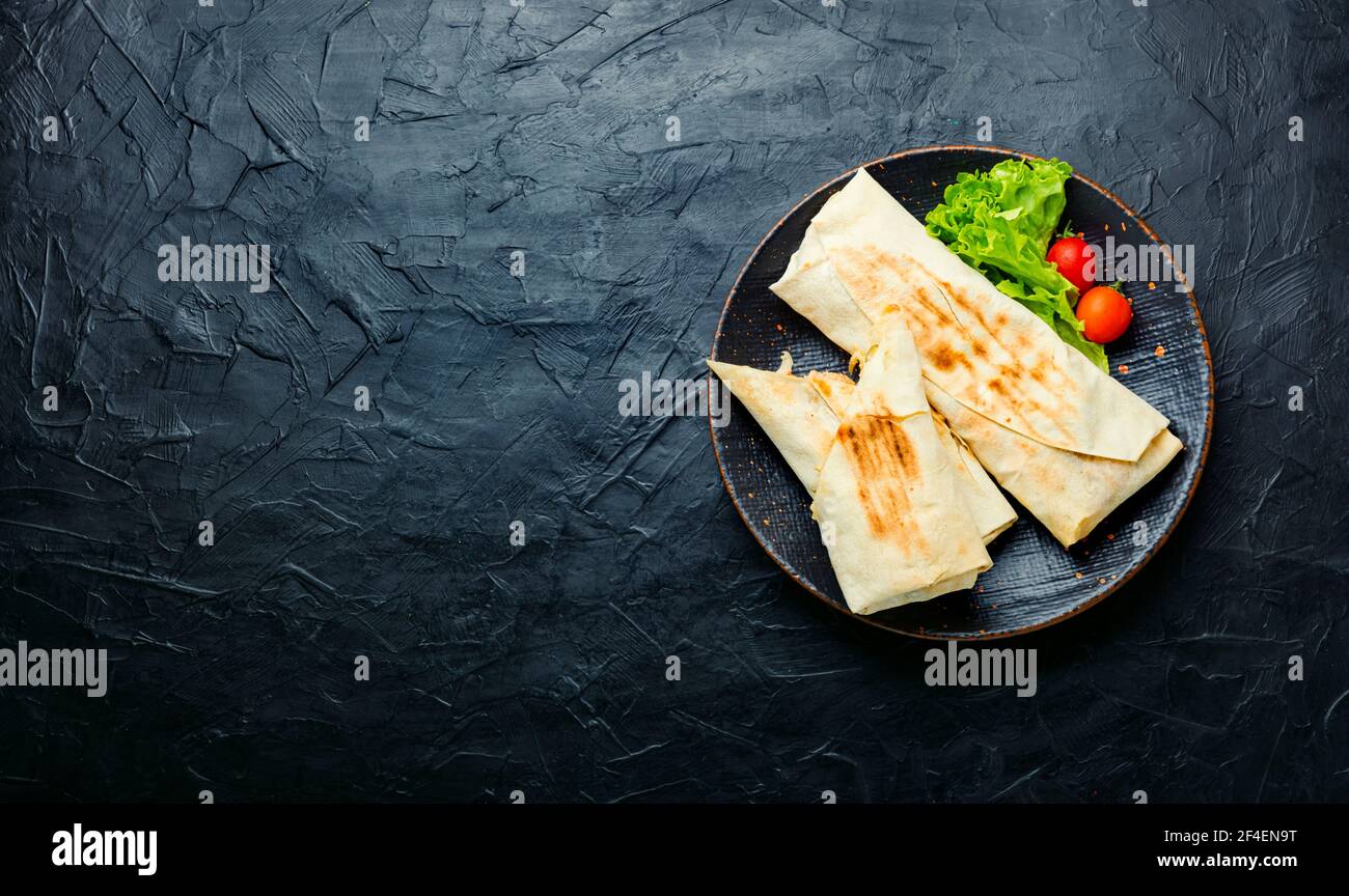 Delicious oriental shawarma with cheese, chicken and mushrooms.Oriental ...