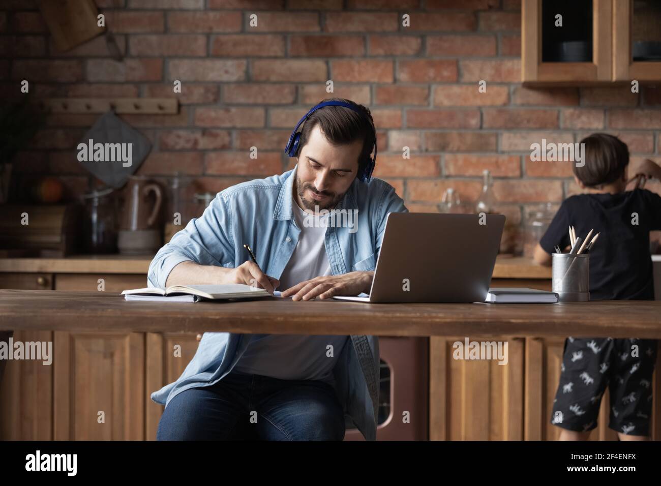 Father working on laptop young hi-res stock photography and images - Alamy