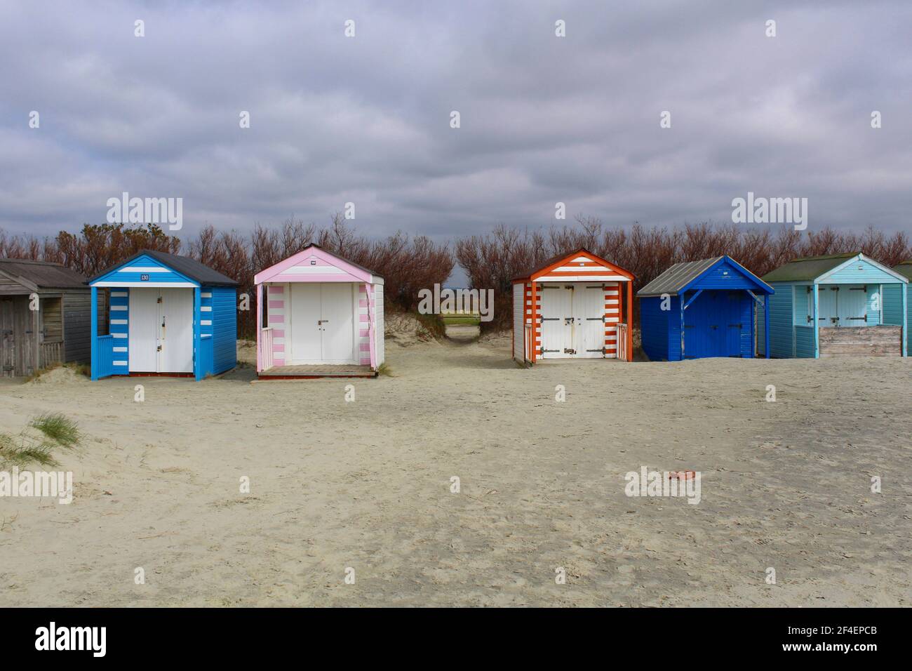 West Wittering beach huts with grey sky copy space to just add text ...