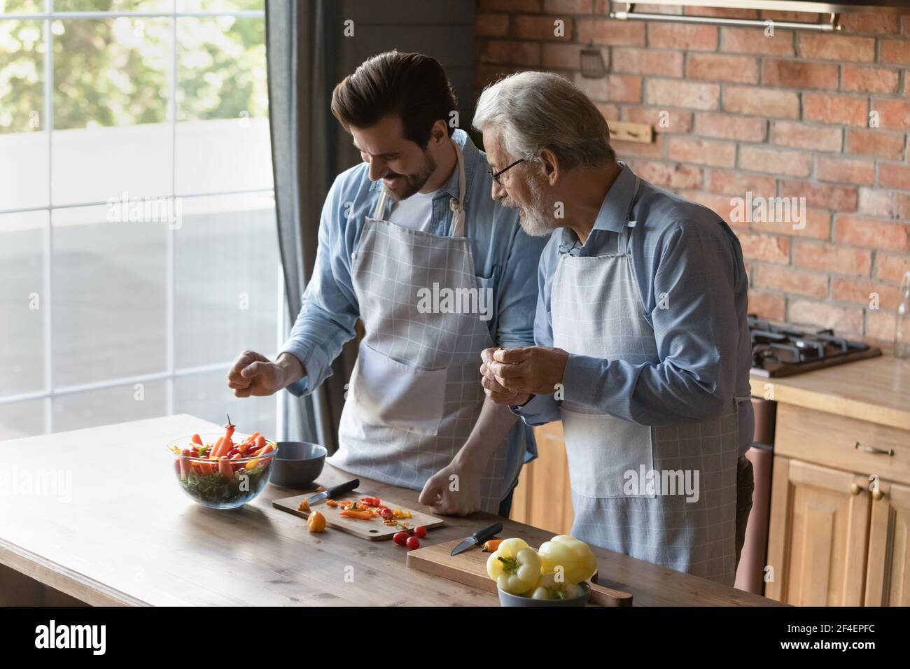 Father son preparing healthy meal the kitchen together hi-res stock ...