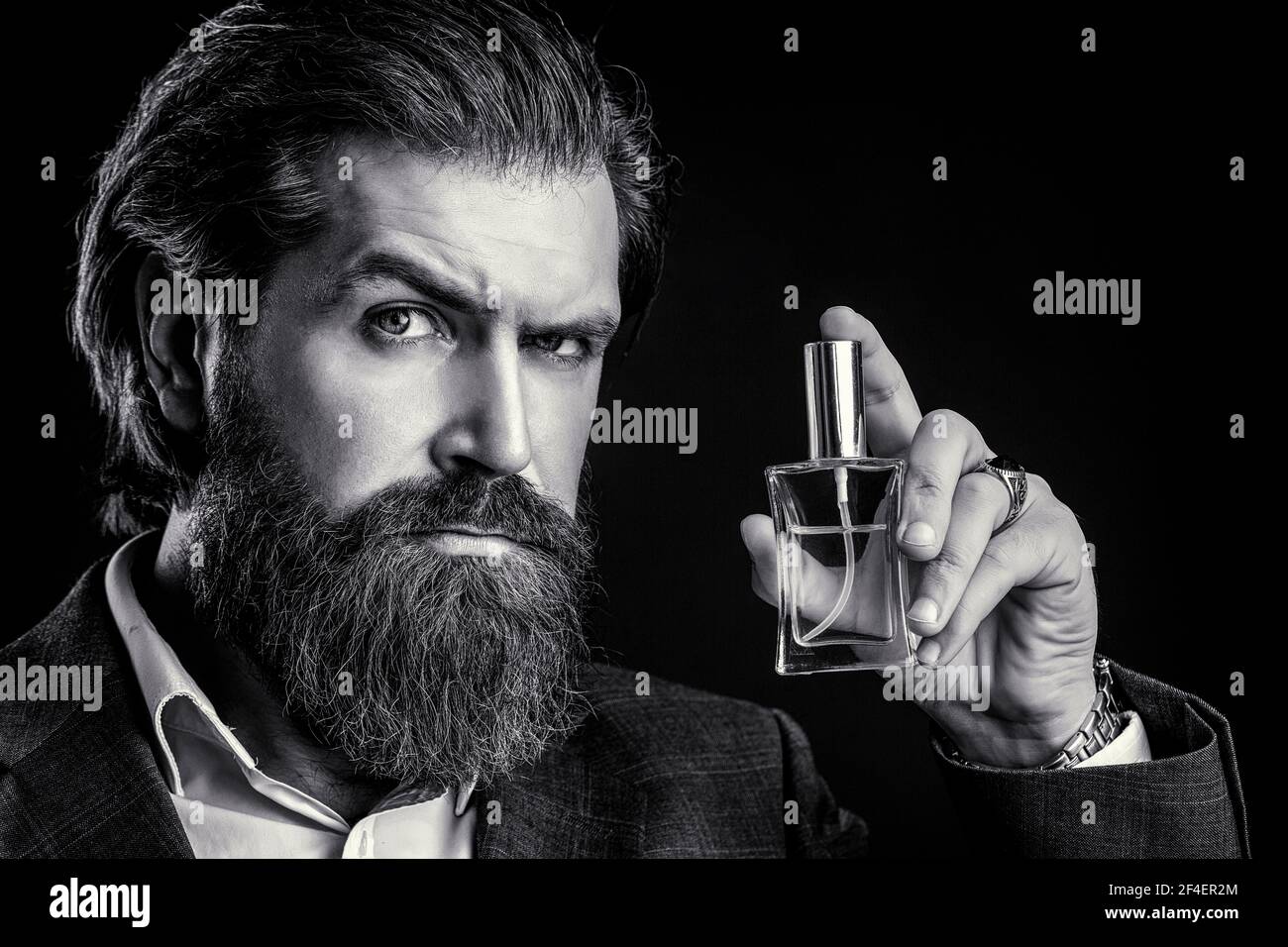 Male holding up bottle of perfume. Man perfume, fragrance. Perfume or ...