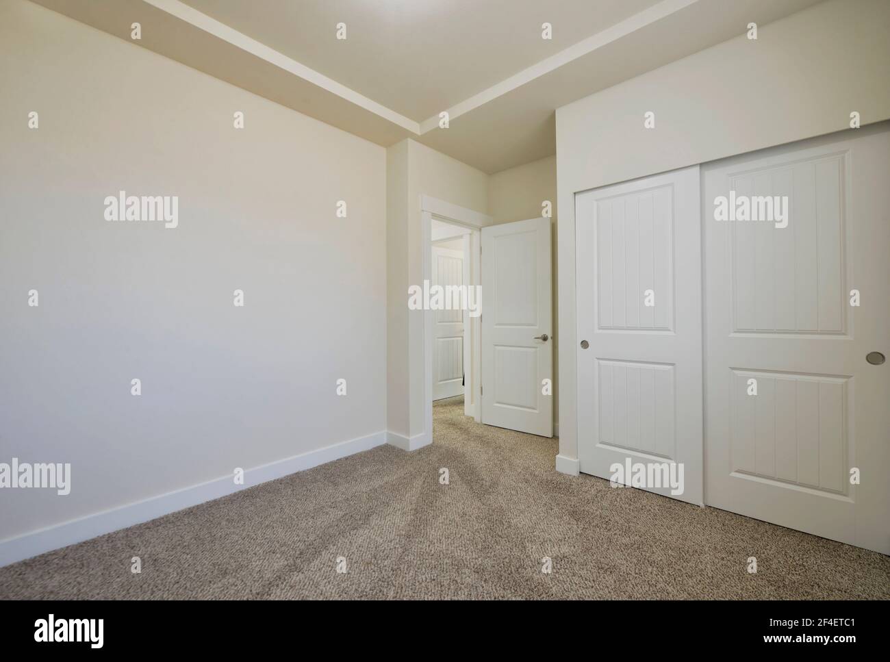 Modern residential empty bedroom interior Stock Photo - Alamy