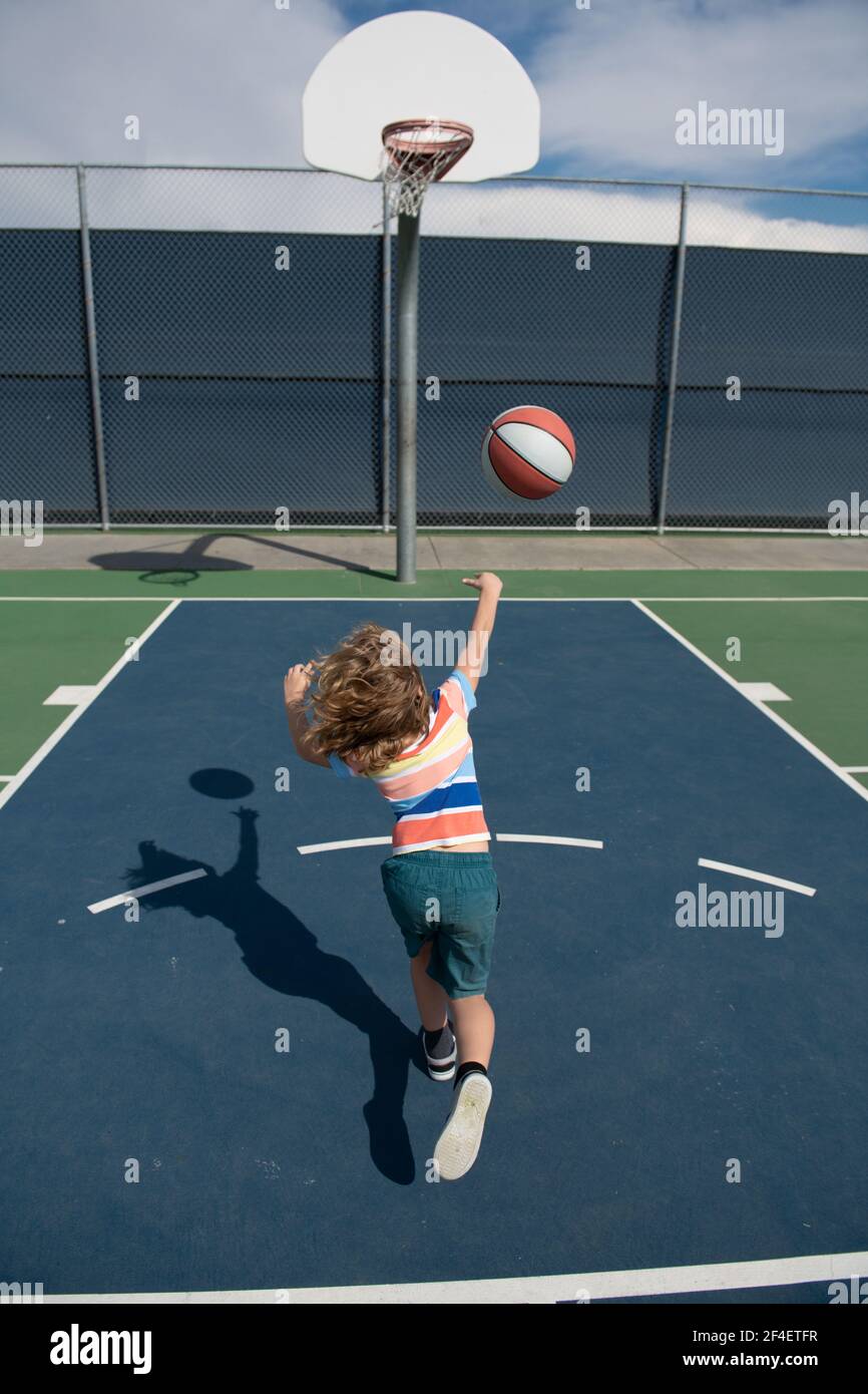 Basketball kids training game. Cute little boy child jumping with ...