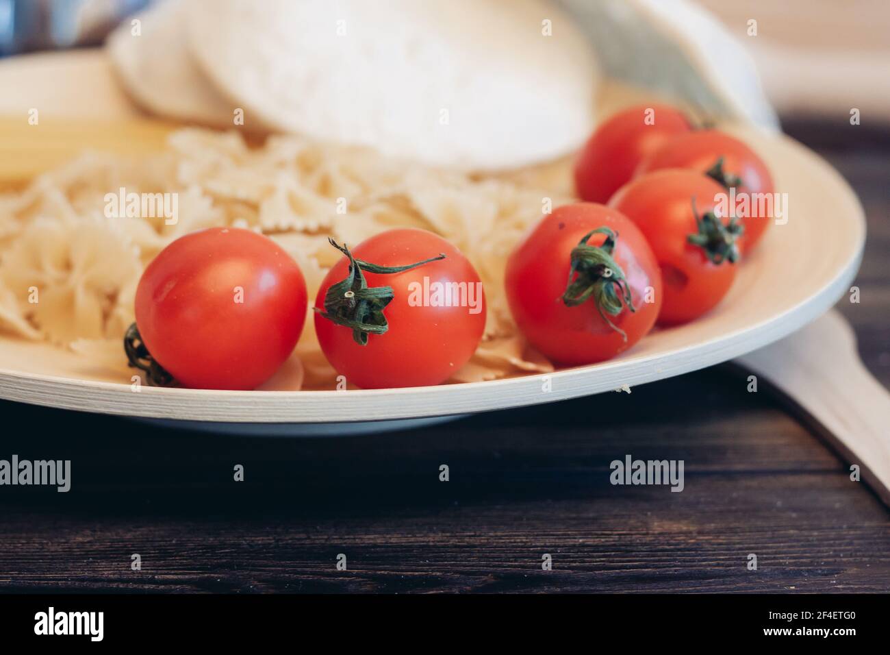 pasta plates italian cuisine cooking wood table Stock Photo - Alamy
