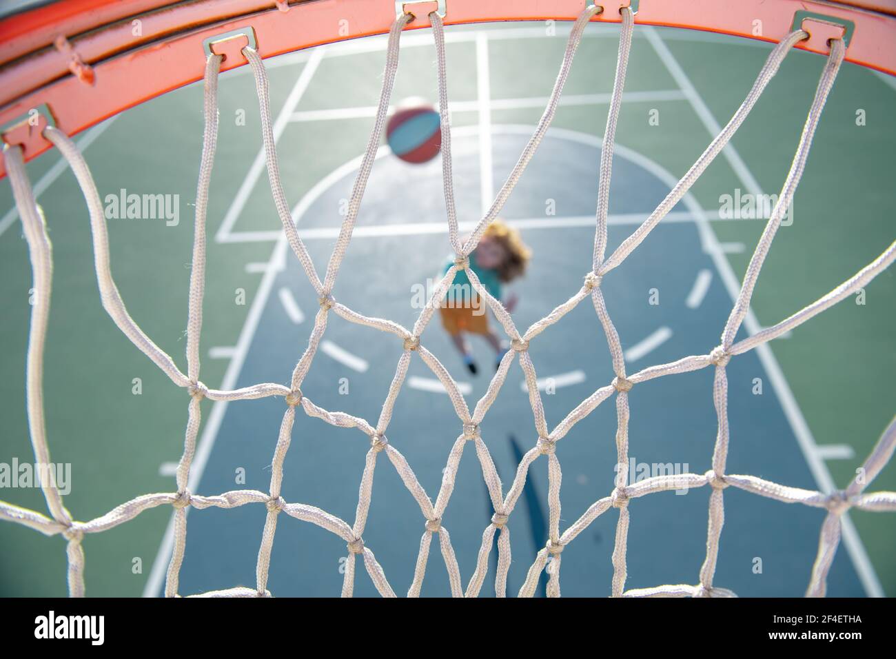 Top view of flying ball to basket from kid play basketball Stock Photo ...