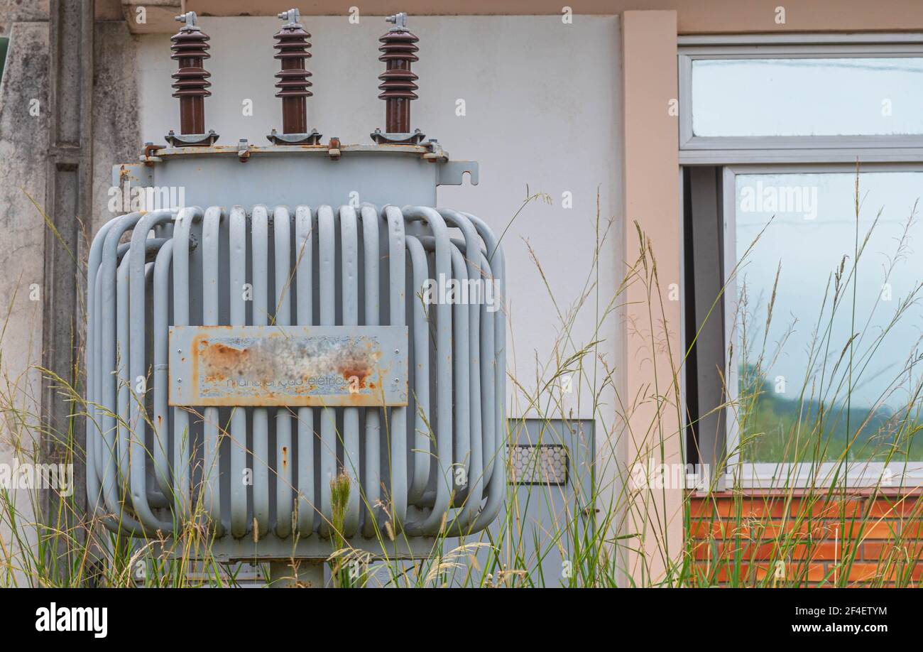 Electricity transformer in abandoned house. Energetic equipment ...
