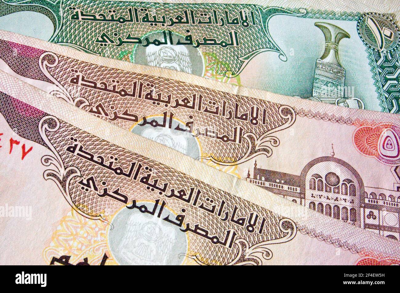 A wallpaper background made of banknotes from the United Arab Emirates ...