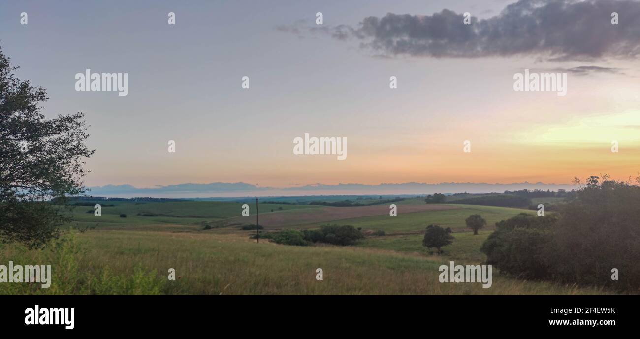 Rural landscape of the fields of the Pampa biome in Brazil. Dusk in ...