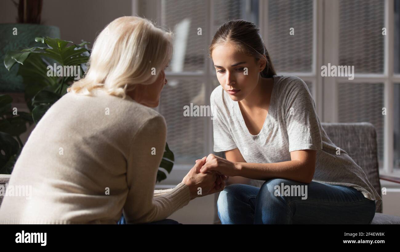 Supportive mature mother comfort unhappy grownup daughter Stock Photo ...