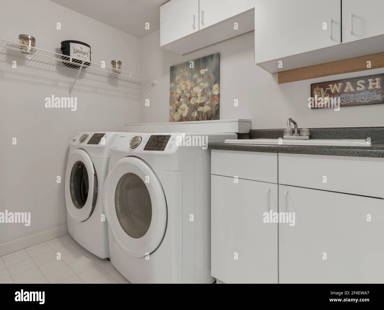 Modern residential laundry room interior Stock Photo - Alamy