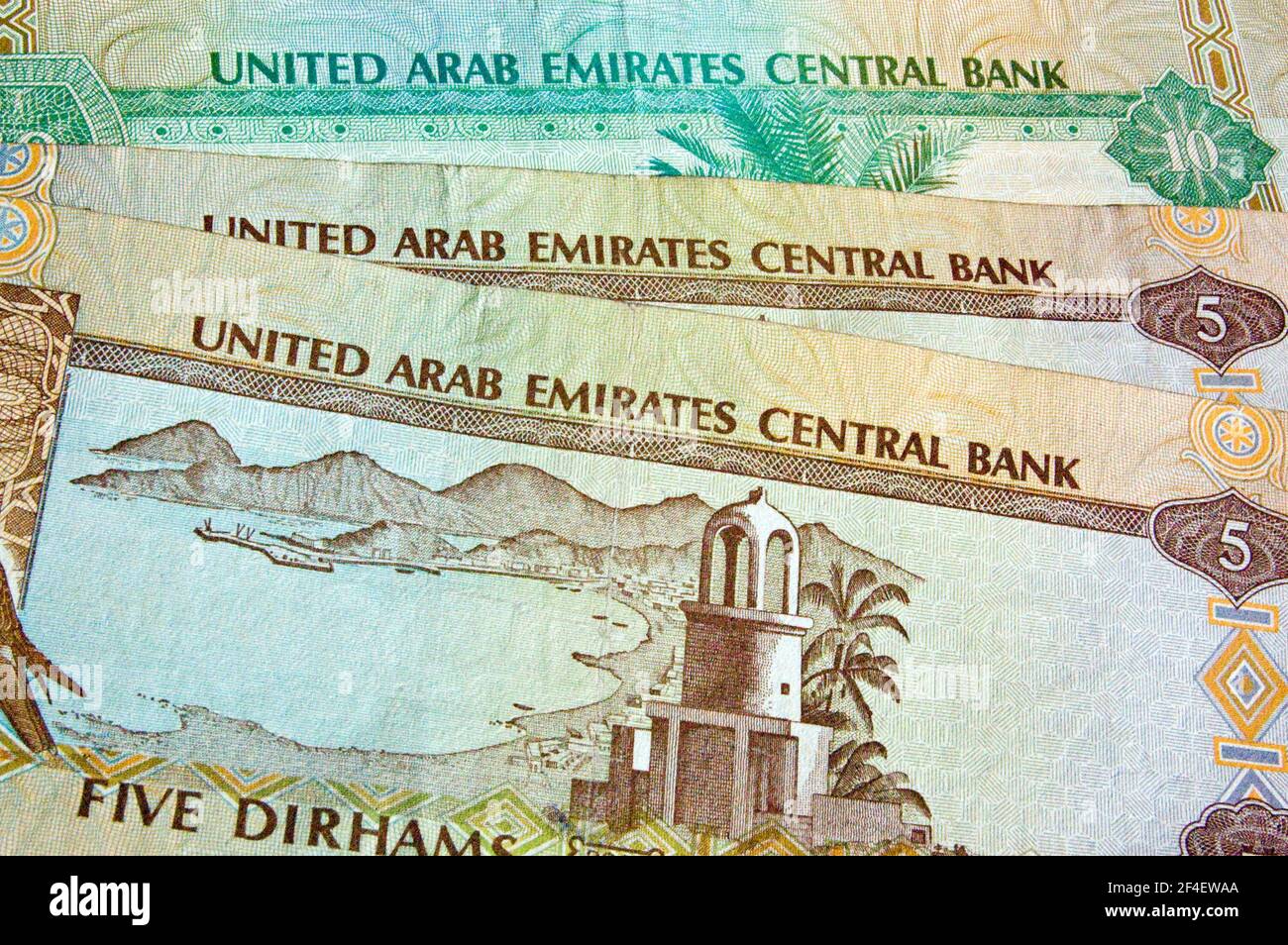 A background composed of banknotes from the United Arab Emirates ...