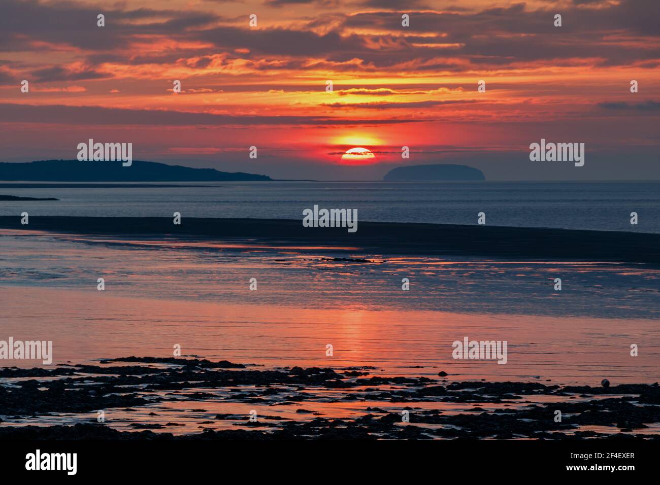 The sun setting over the Bristol Channel Stock Photo - Alamy