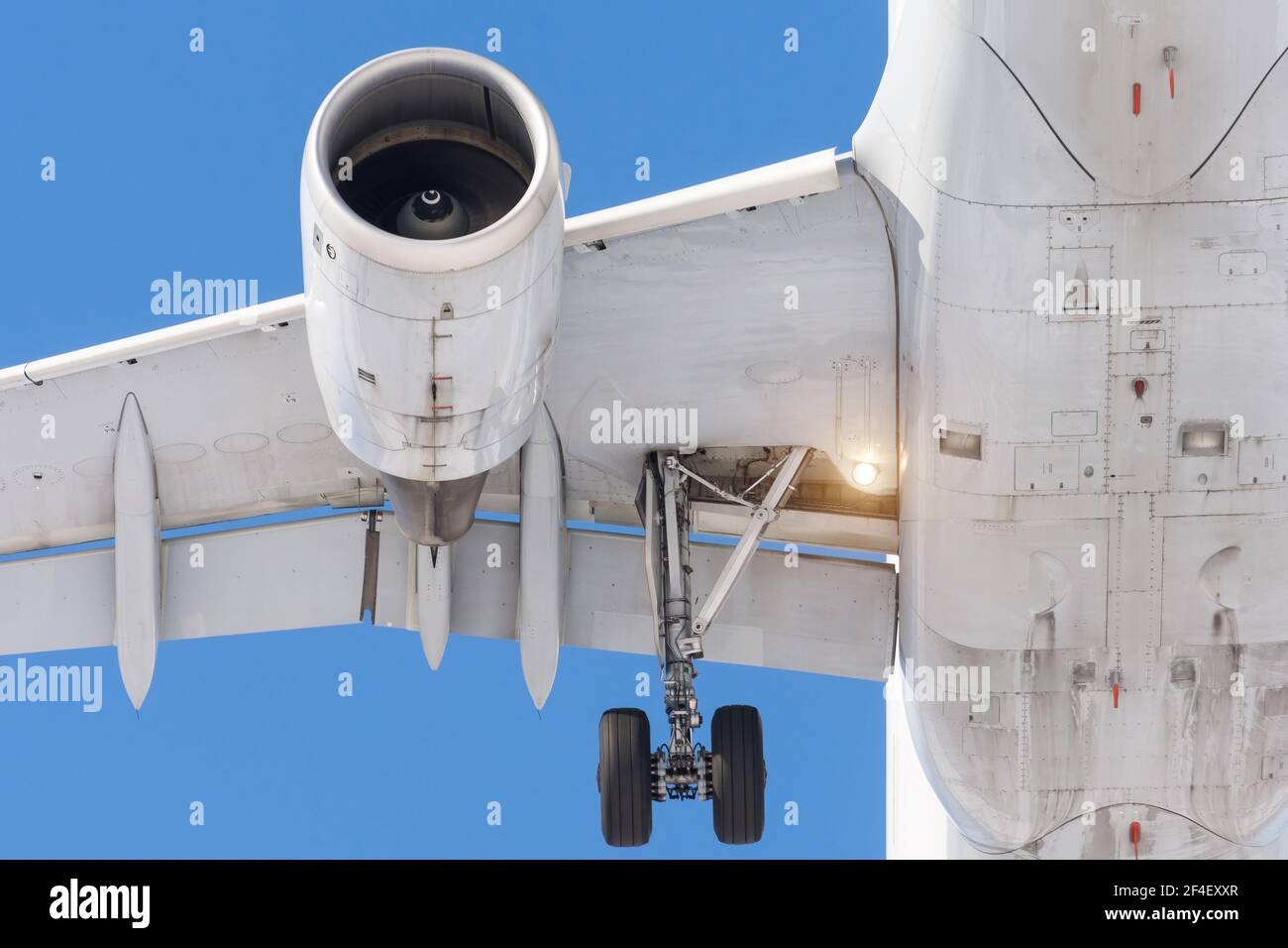 Jet engine with shiny metal, wing with flaps, lights rubber wheel ...