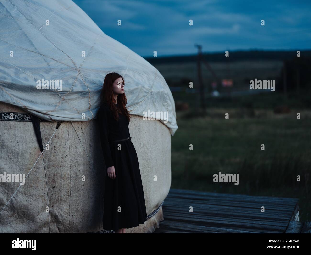 A woman in a dress near the traditional Mongolian dwelling yurt Stock ...