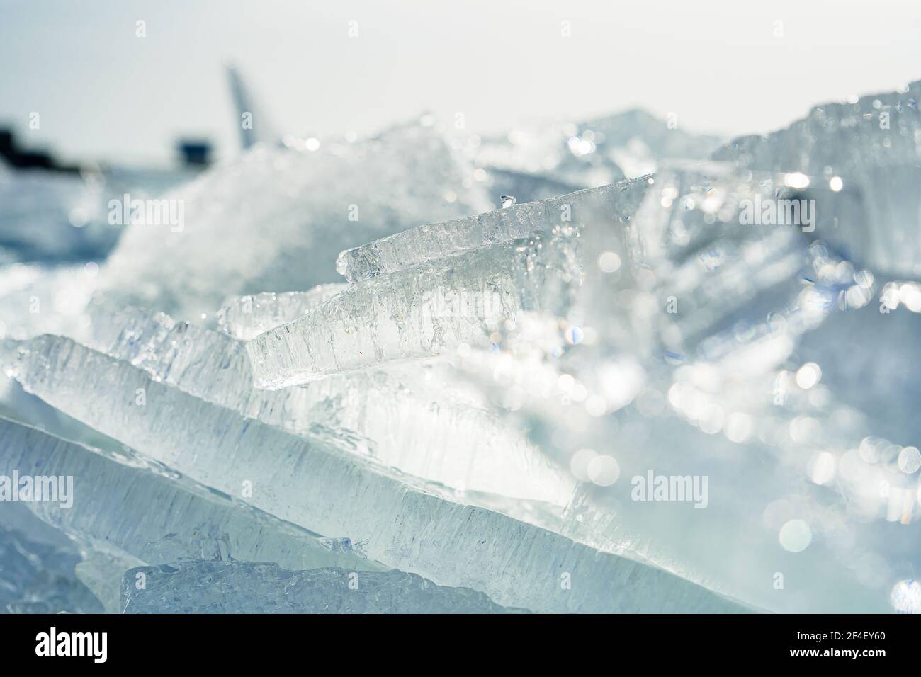 Ice floe breaking up against shore with sea ice during freezing winter ...