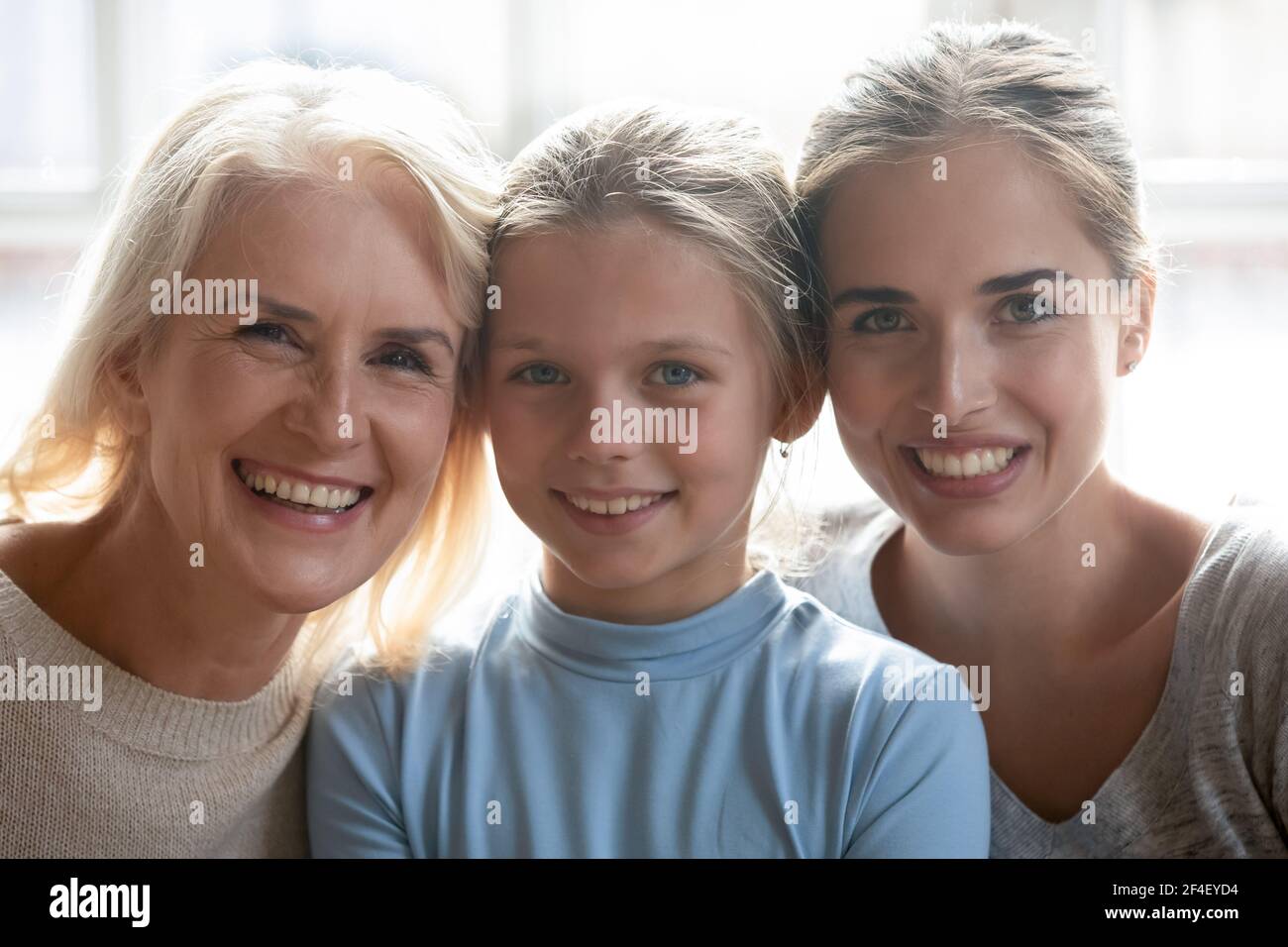 Portrait of happy three generations of women Stock Photo - Alamy