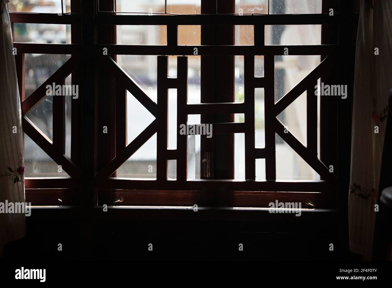 wooden banister balcony frame decorating near glass window ...