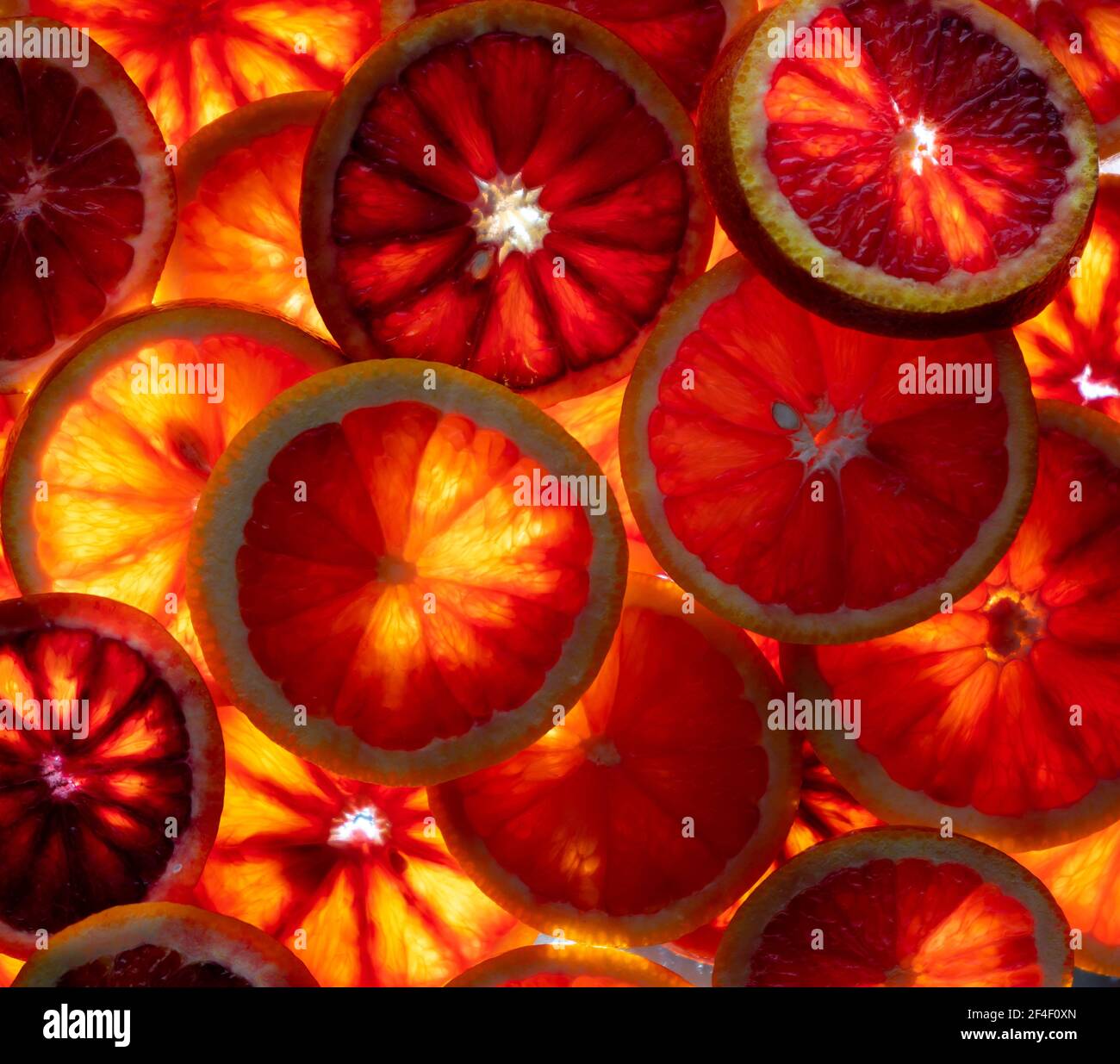Red oranges fruit background. Sliced juicy orange. Food. Summer concept ...