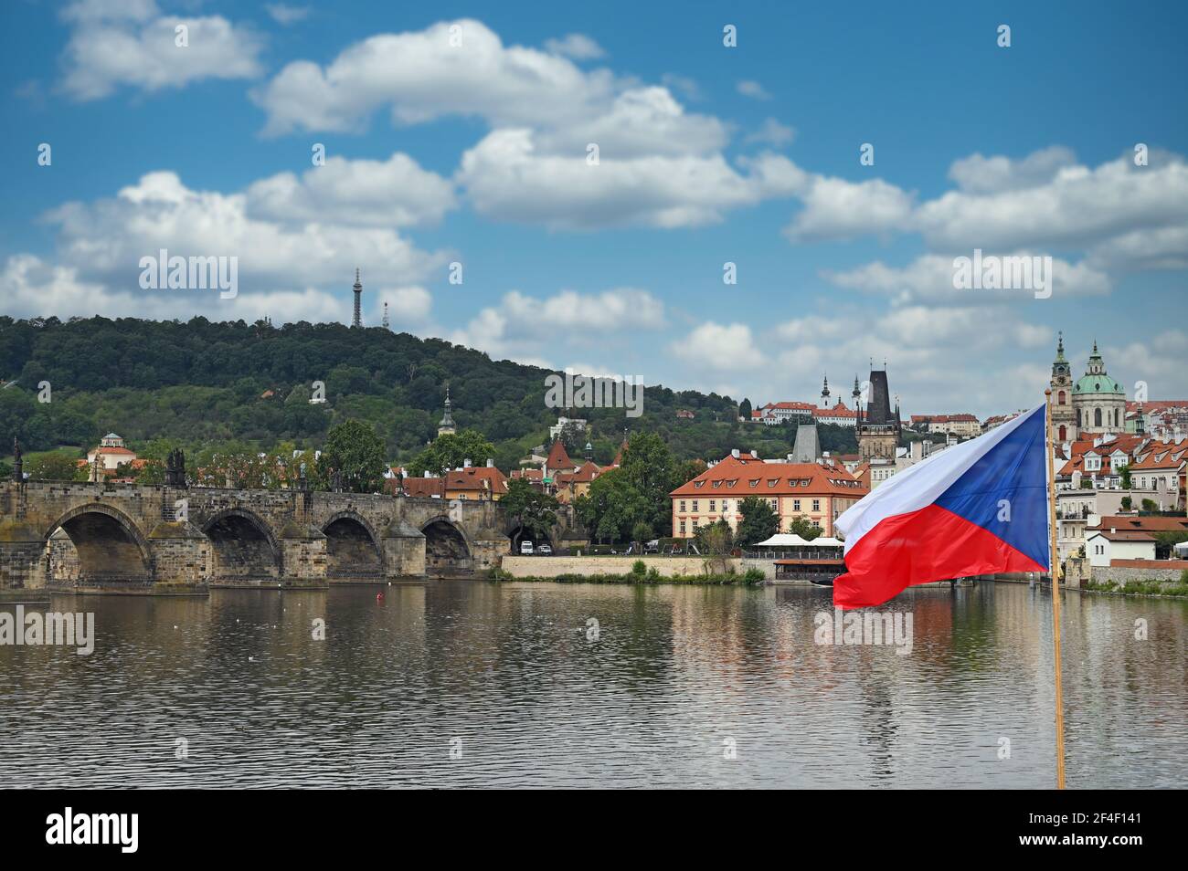 Charles bridge and Czech flag Prague cityscape Stock Photo - Alamy