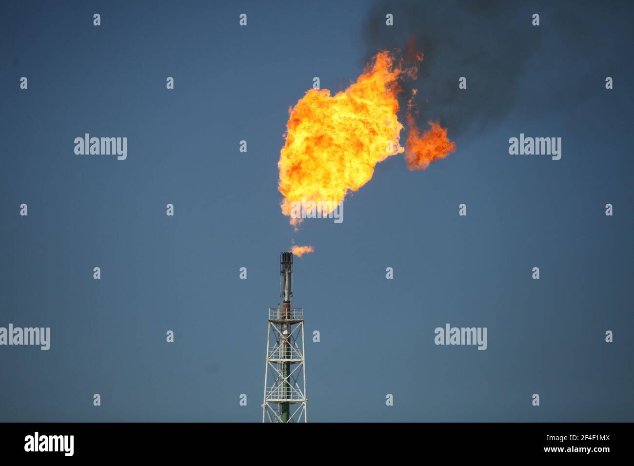 Burning orange nature gas torch. Strong flame. On oil refinery plant on ...
