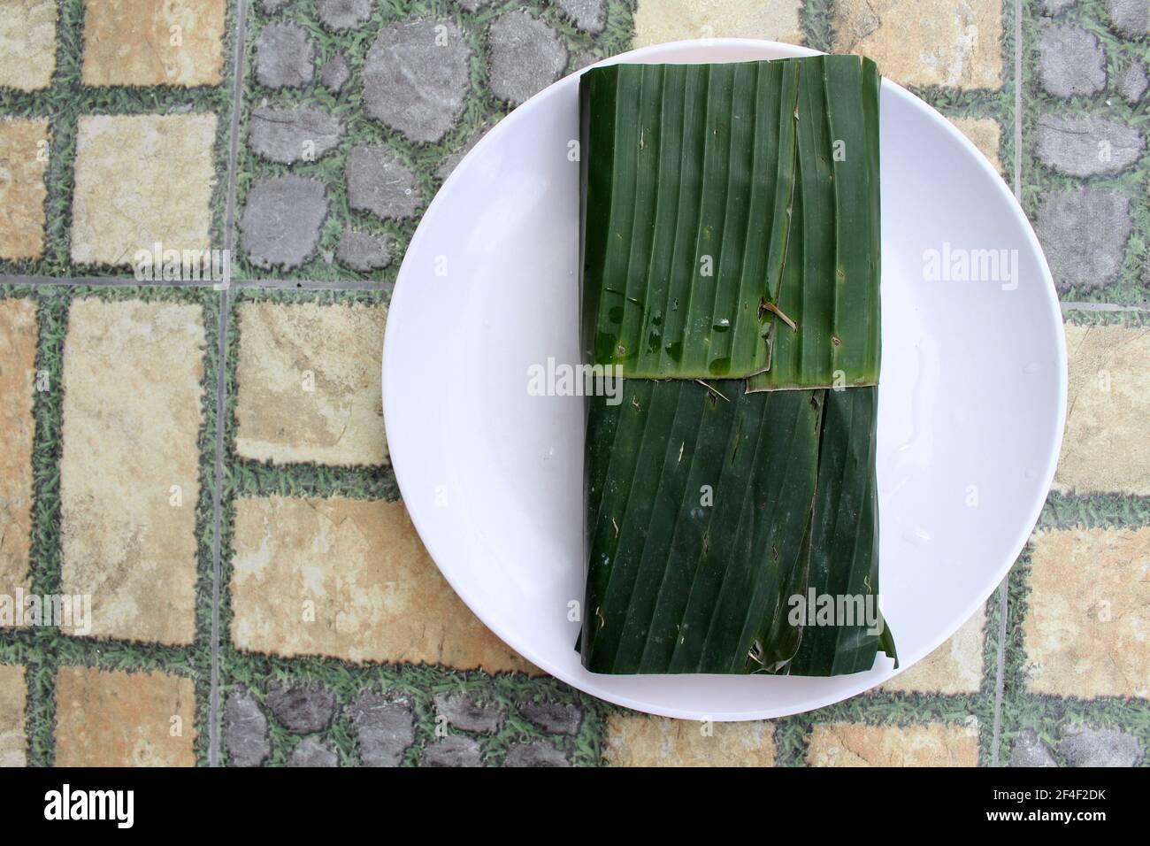 Tempe or tempeh wrapped in banana leaves. Traditional protein source in ...